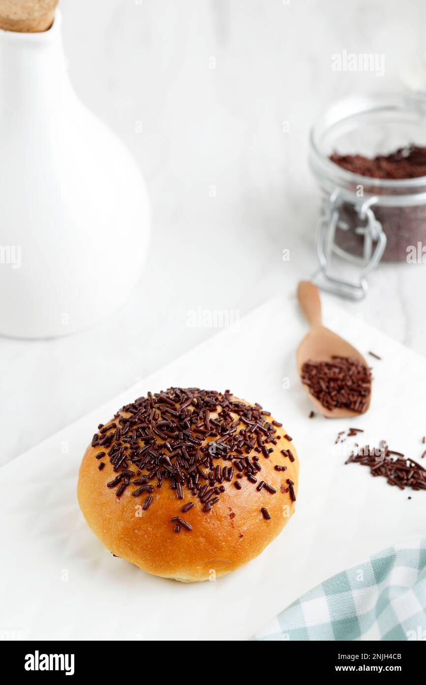 White Bread Bun with Chocolate Sprinkle or Meses, on White Table Stock ...