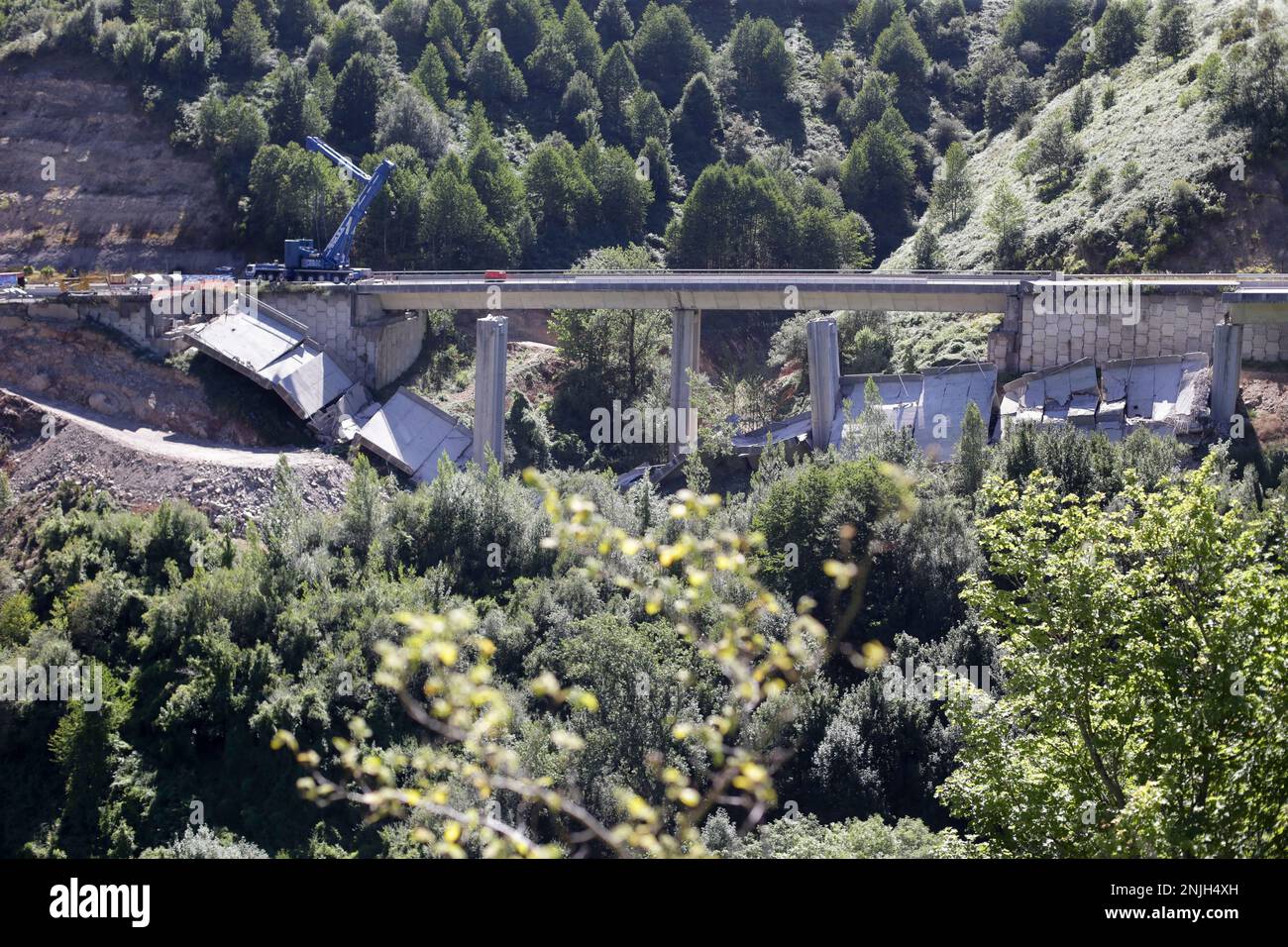 Operators and cranes work during the dismantling of the third and last ...