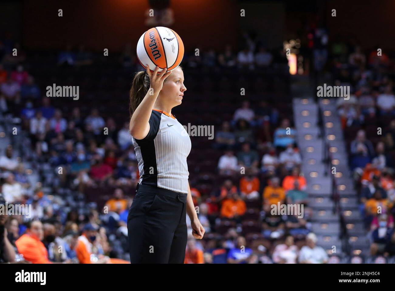 UNCASVILLE, CT - AUGUST 18: Referee Jenna Reneau prepares to put the ...