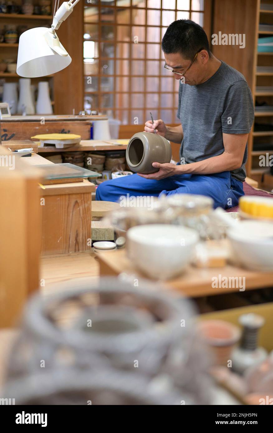 Doburo yakimonoshi (brazier maker and potter) Zengoro Eiraku makes a ...