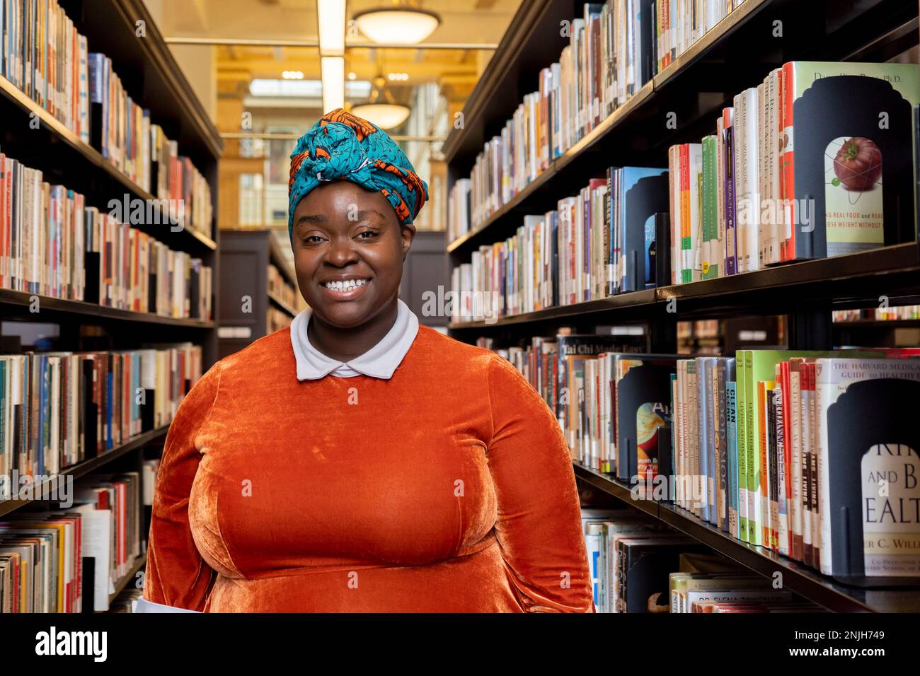 Araba Maze is pictured in the aisles of Central Library in Mount Vernon ...