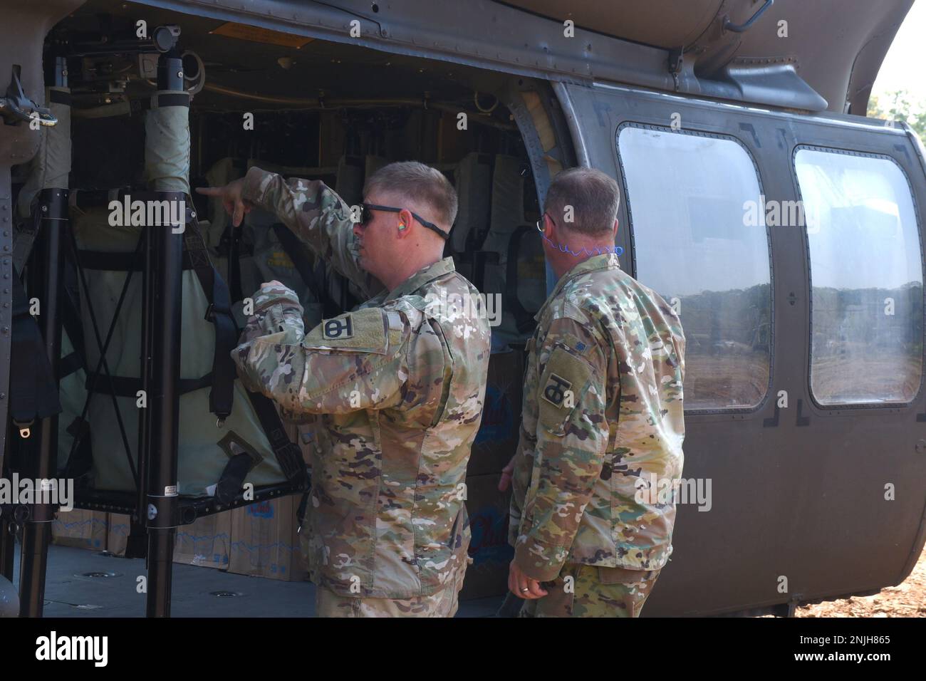 U.S. Army soldiers from the 90th Sustainment Brigade begin unstrapping ...