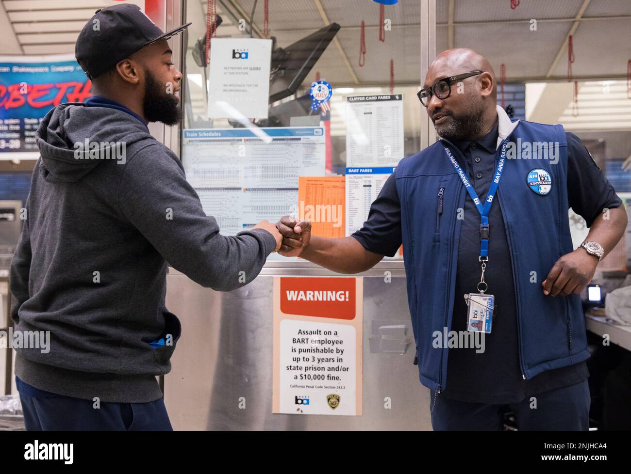 BART Station Agent William Cromartie greets a fellow employee while ...