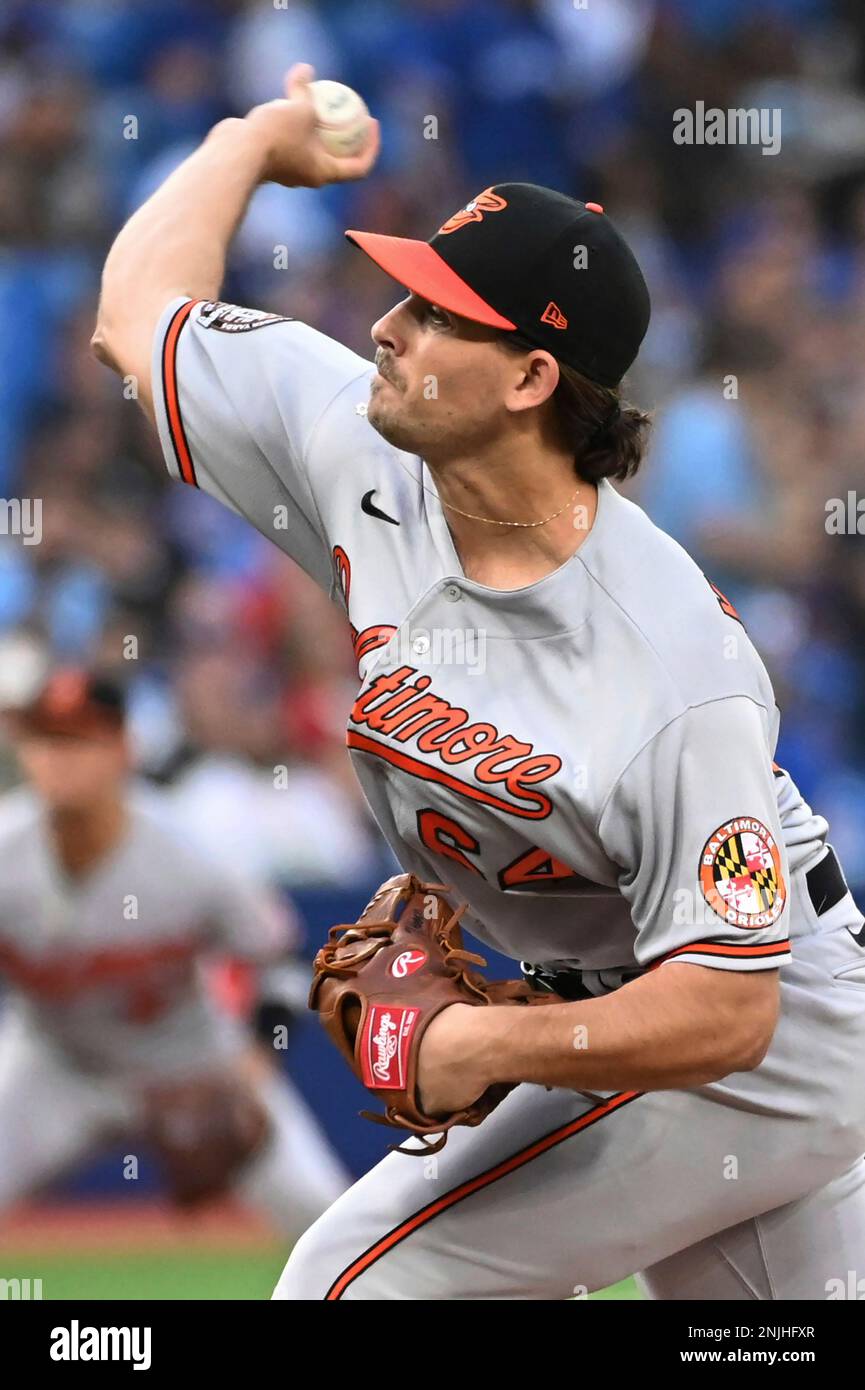 Baltimore Orioles starting pitcher Dean Kremer throws to a Toronto Blue ...