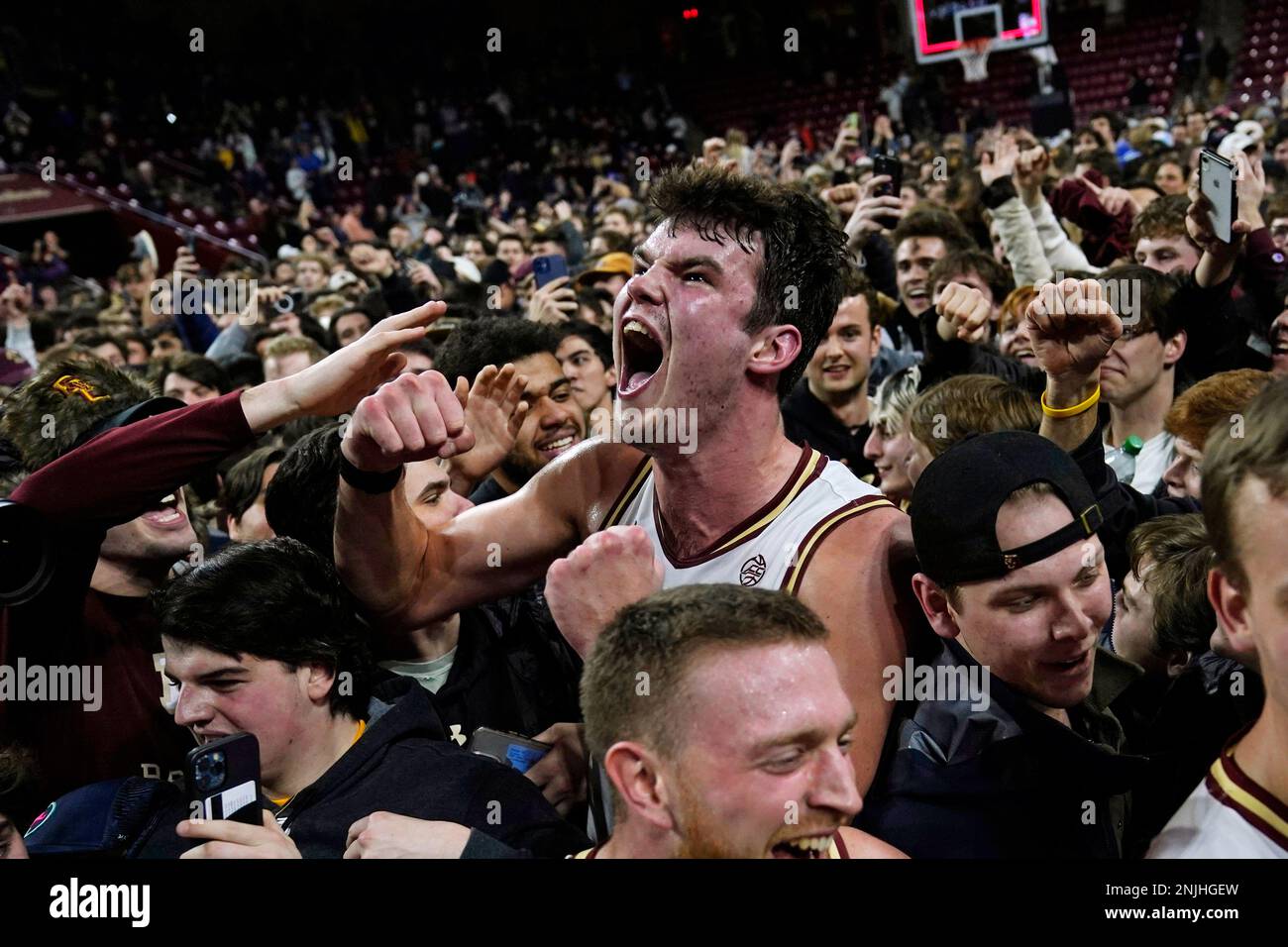 Boston College forward Quinten Post celebrates with fans after ...