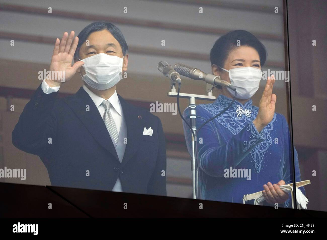 Japan's Emperor Naruhito, with Empress Masako, waves towards well ...