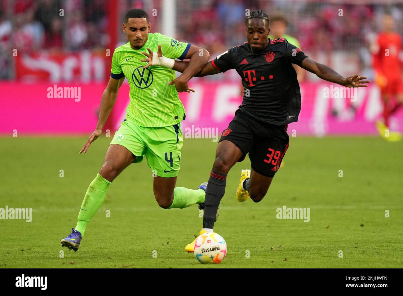 Bayern's Mathys Tel vies for the ball with Wolfsburg's Maxence Lacroix ...