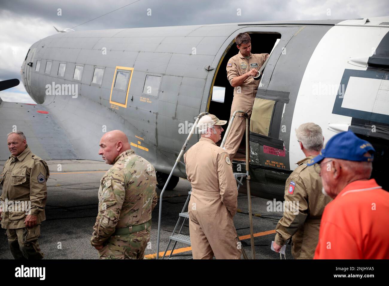 Pilot Garrett Fleishman tapes the doorway of the Placid Lassie, a ...