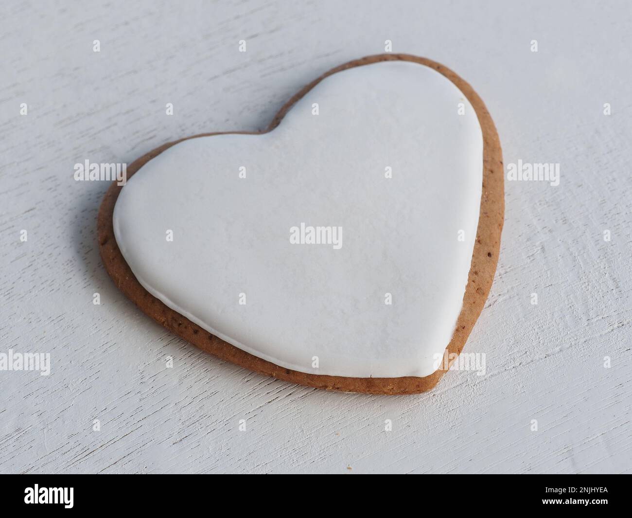 Heart shaped sweet white cookie Stock Photo - Alamy