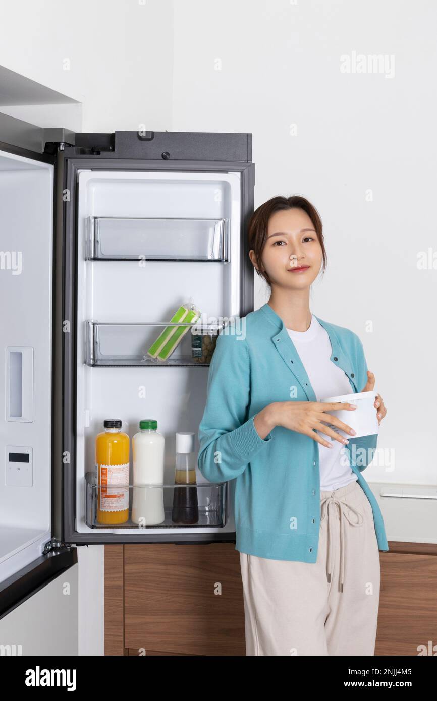 happy single life of korean woman look inside the fridge Stock Photo ...