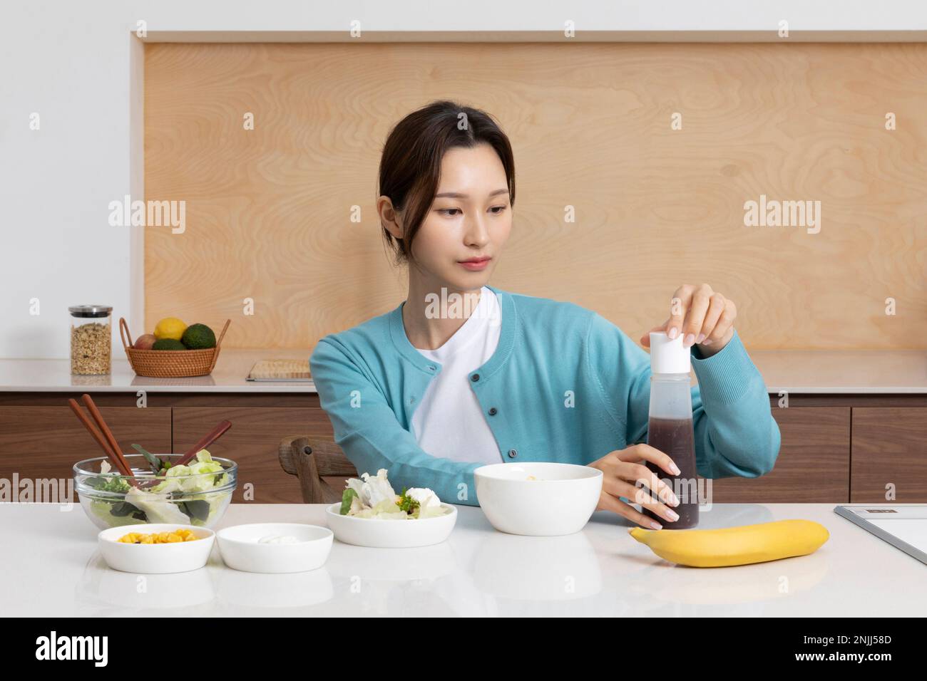 happy single life of korean woman cooking Stock Photo - Alamy