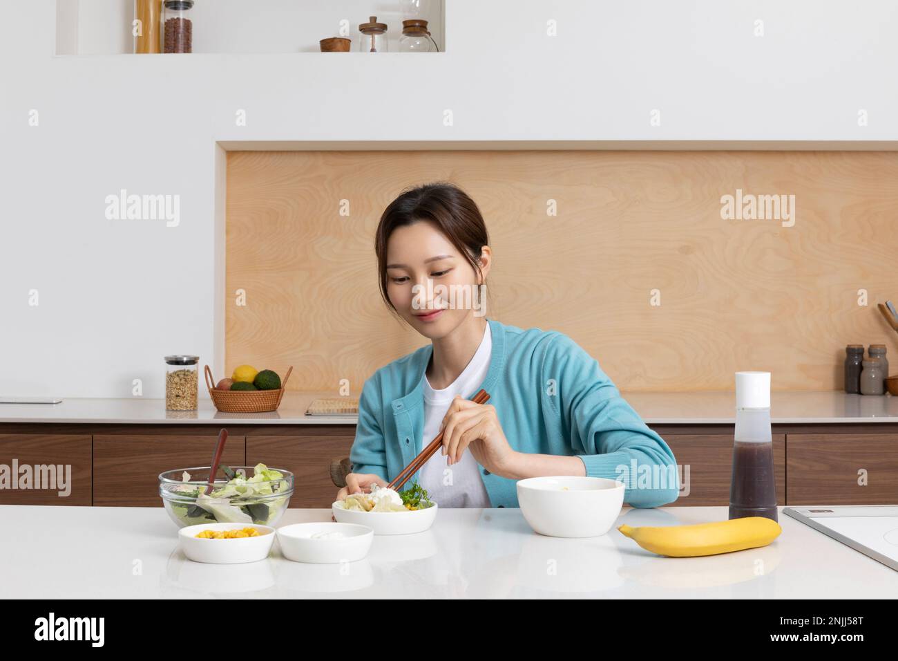 happy single life of korean woman cooking Stock Photo - Alamy