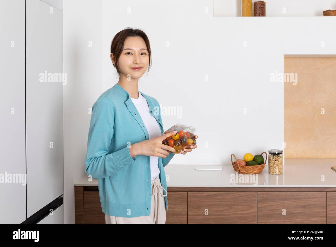 happy single life of korean woman cooking Stock Photo - Alamy