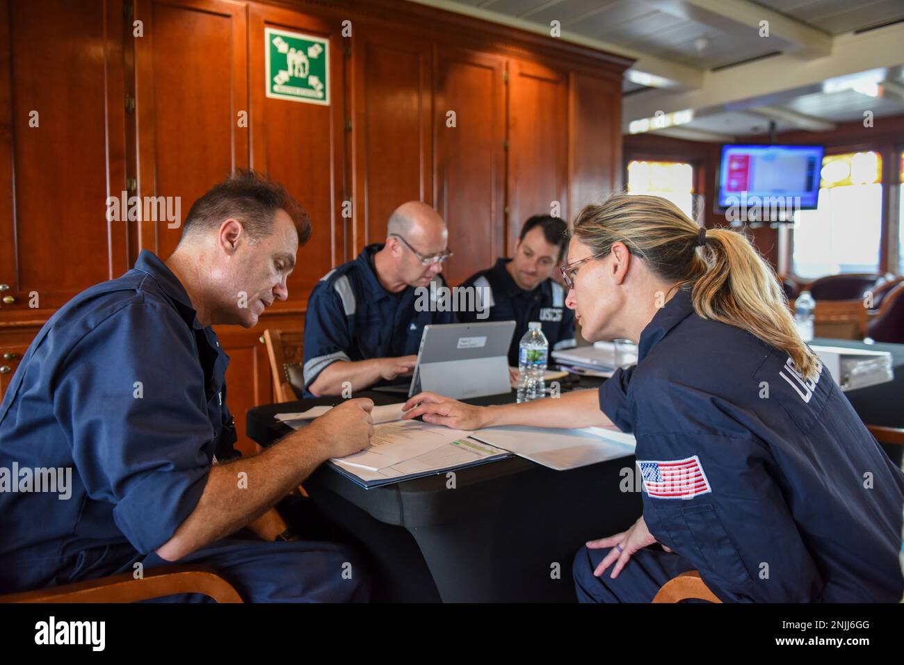 A U.S. Coast Guard inspection team aboard the Ocean Voyager cruise ship ...