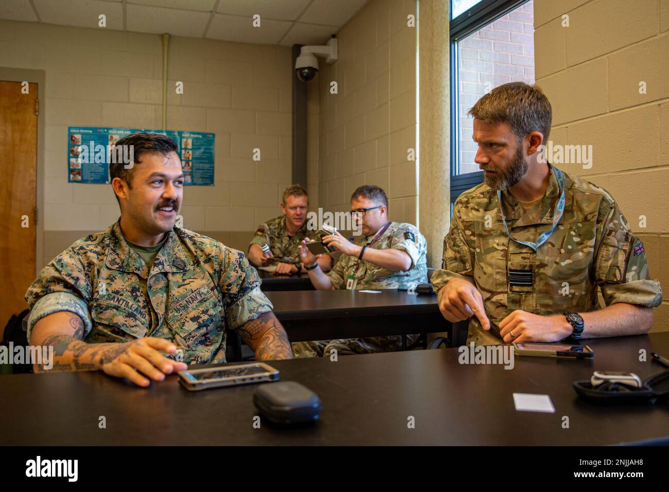 U.S. Navy Hospital Corpsman 3rd Class Lucas Santillano, left, a ...