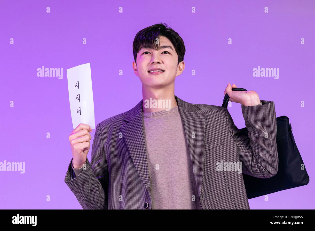 handsome Korean young man holding a letter of resignation Stock Photo ...
