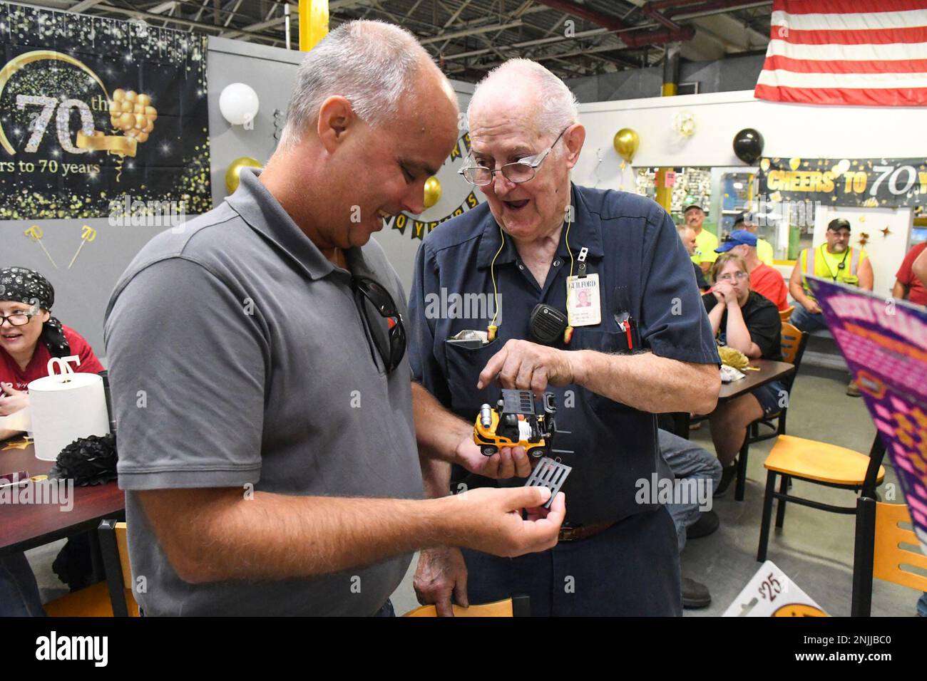 Plant manager Justin Hocker, left, shows forklift operator Ernie Rehrer ...