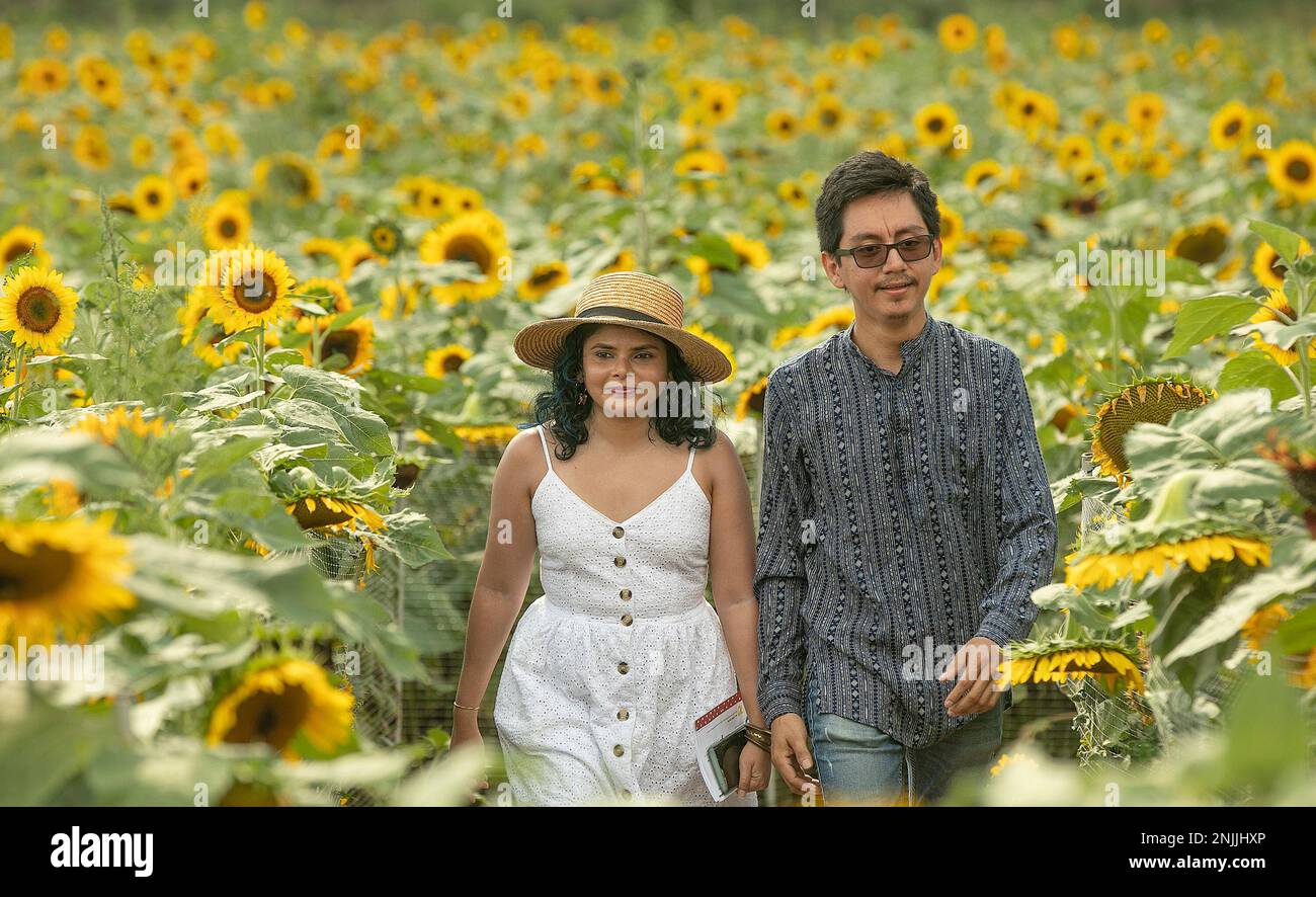 Devanshi Italiya, left, and Nery Avila, of West Haven, walk a path ...
