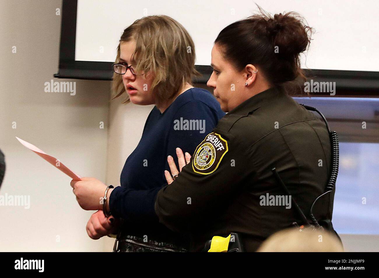 FILE- Morgan Geyser is escorted out of the courtroom following her ...
