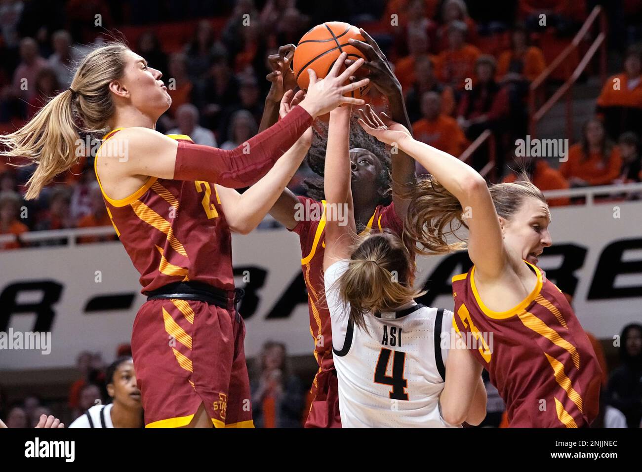 Iowa State guard Ashley Joens, left, forward Nyamer Diew, rear, and ...