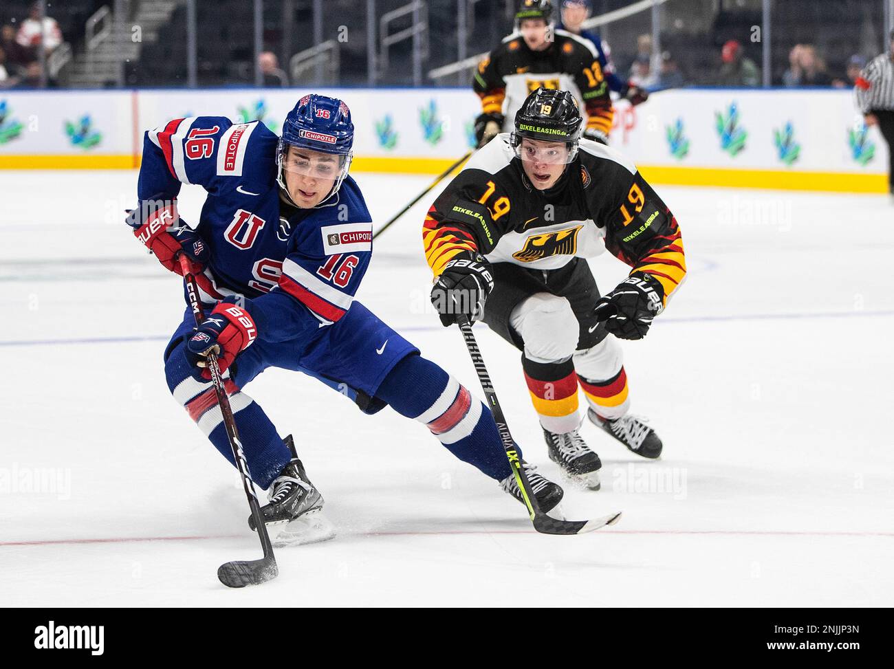 United States' Dominic James (16) and Germany's Haakon Hanelt (19) vie ...