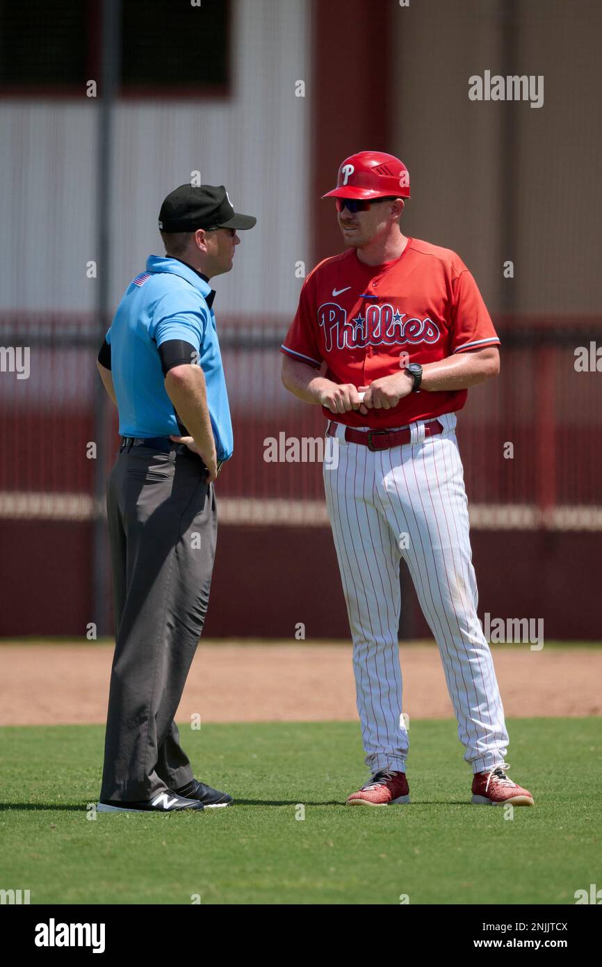FCL Phillies manager Chris Adamson (30) questions a balk call with ...