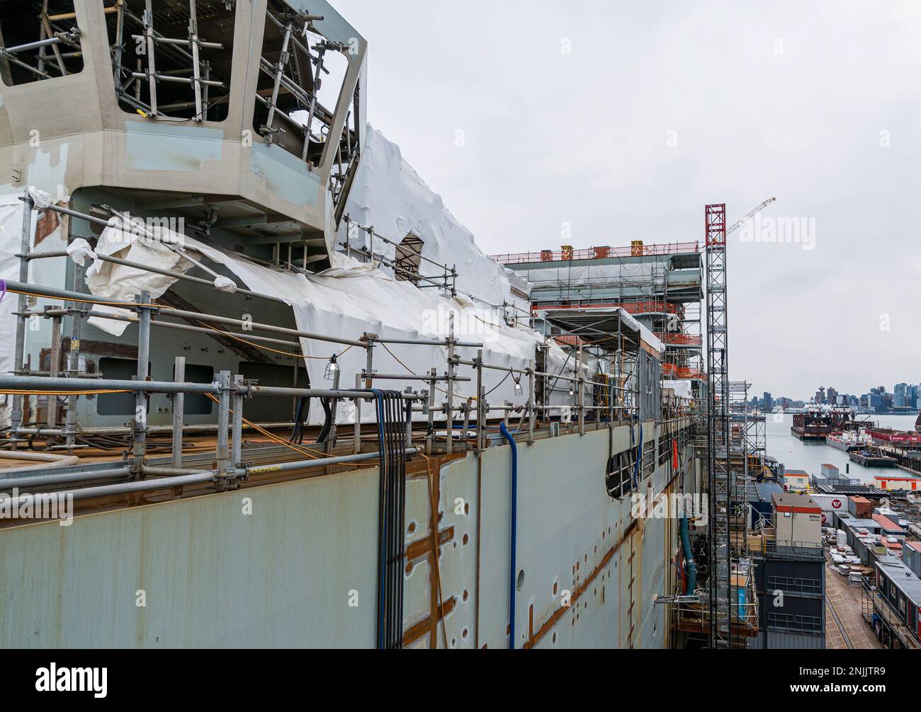 A worker enters the Joint Support Ship being built for the Royal ...