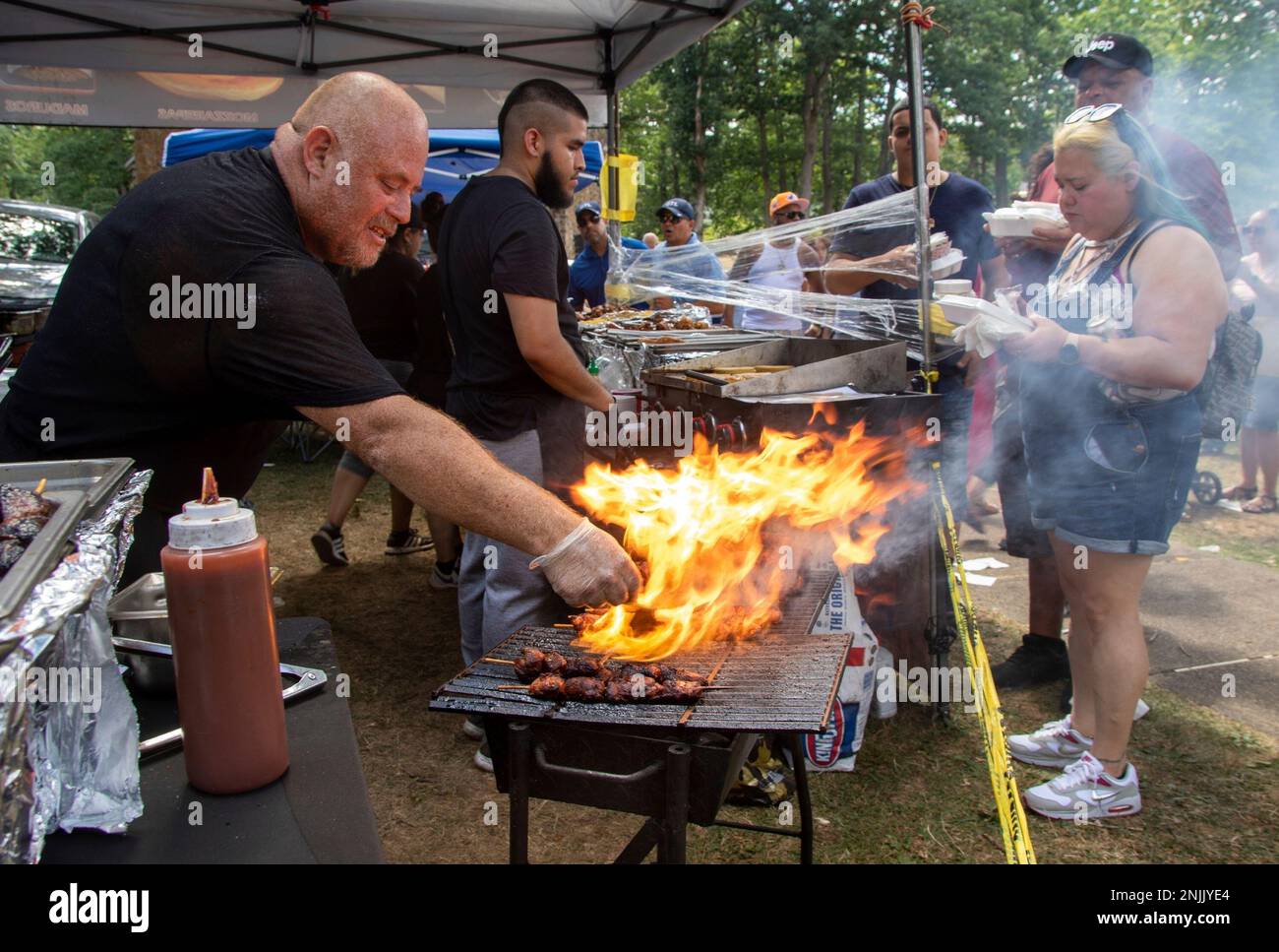 John Ramirez cooks shish kabobs on a grill at the Las Delicias Del ...