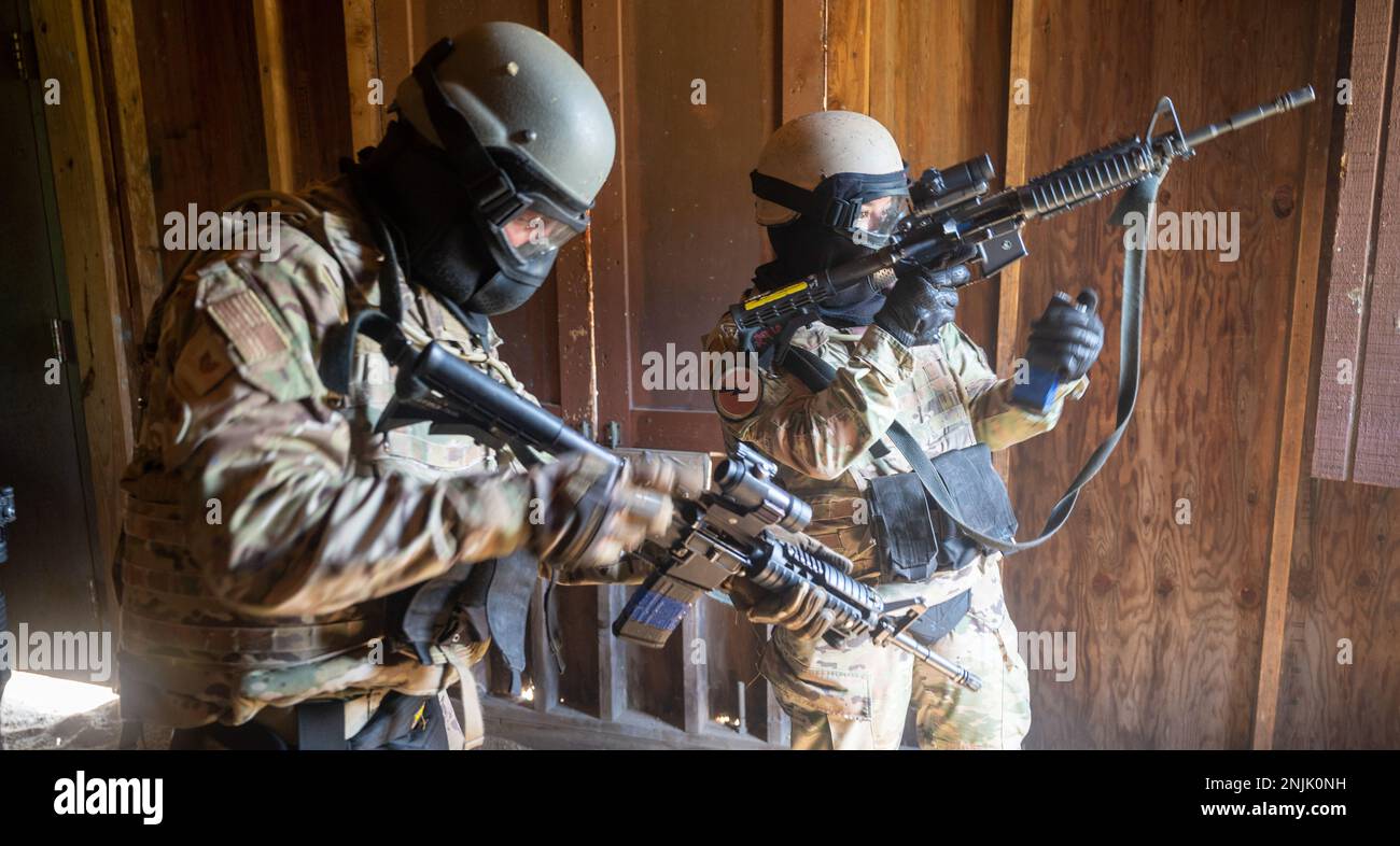 U.S. Air Force Airmen reload their weapons during Fieldcraft Hostile at ...