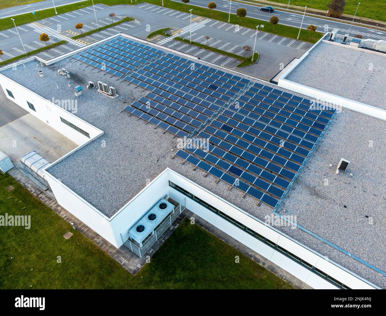 Commercial building (store) with solar panels on the roof. Drone shot ...