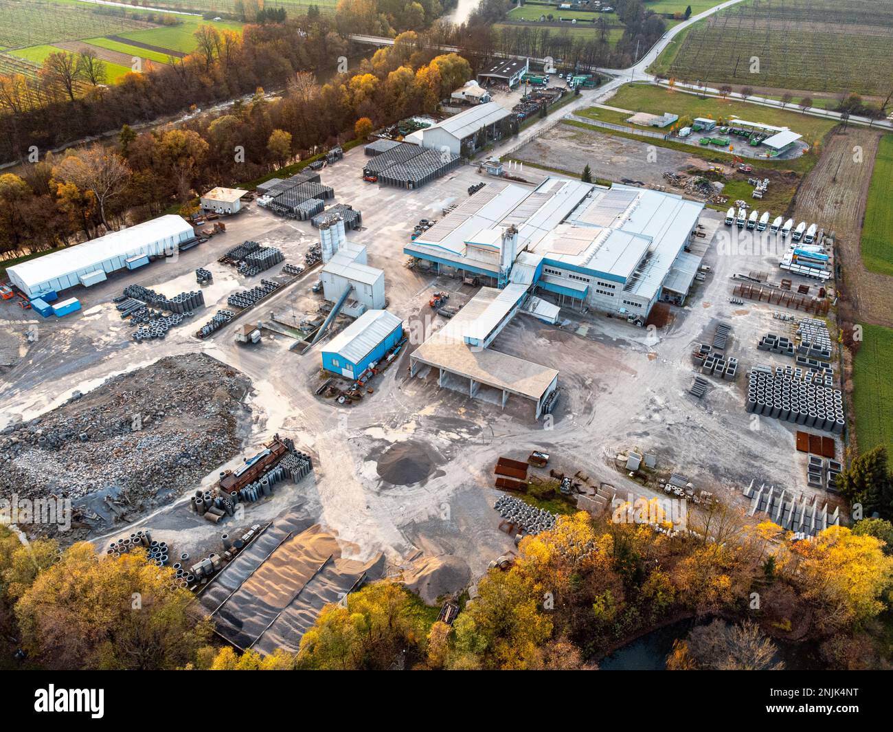 Factory that produces concrete products like tiles, concrete pipes and ...