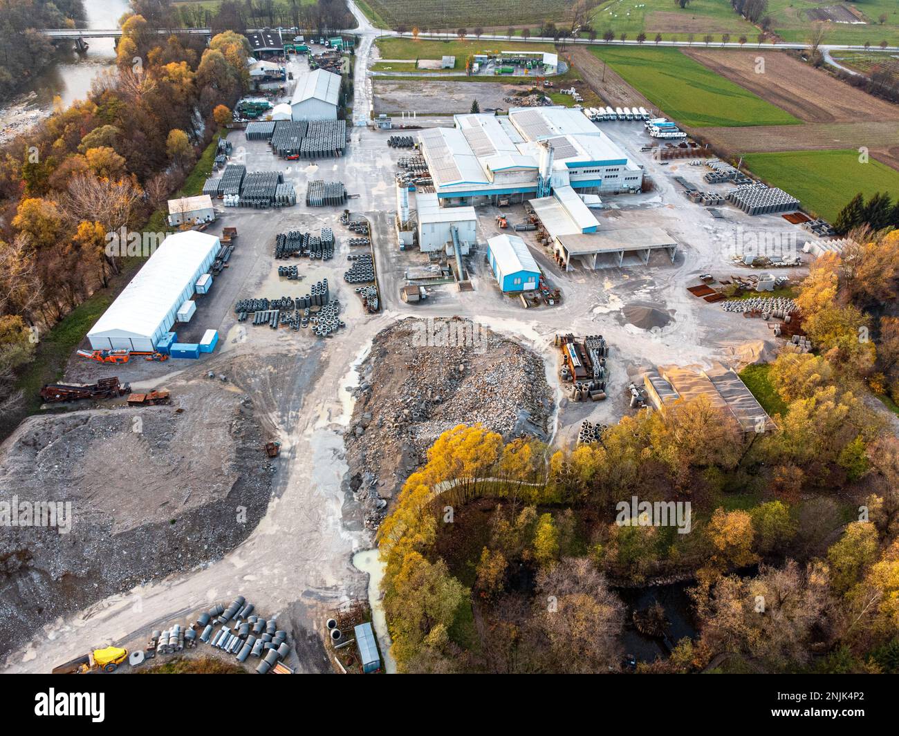 Factory that produces concrete products like tiles, concrete pipes and ...