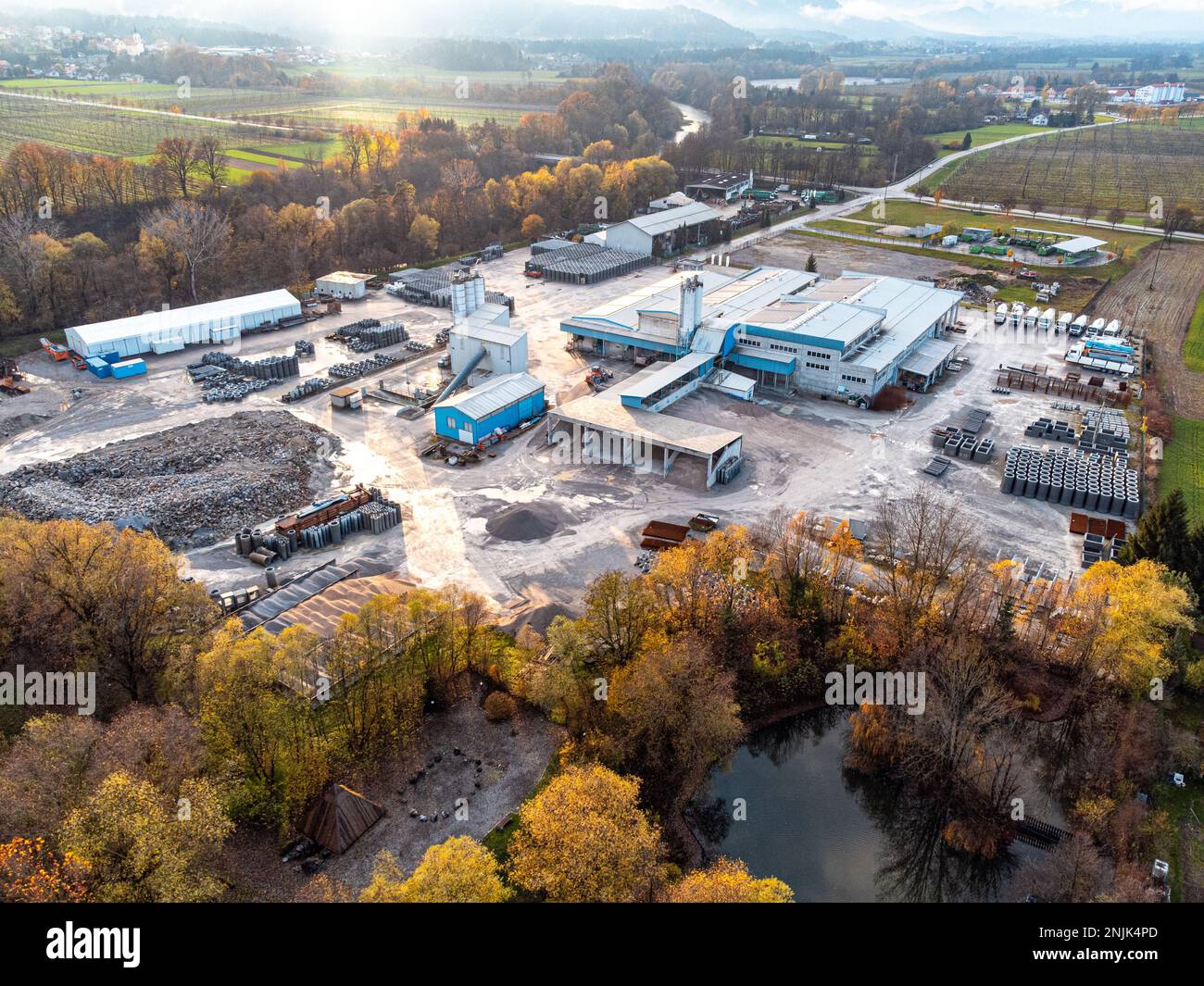 Factory that produces concrete products like tiles, concrete pipes and ...