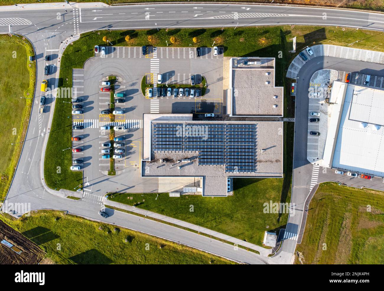 Commercial building (store) with solar panels on the roof. Drone shot ...