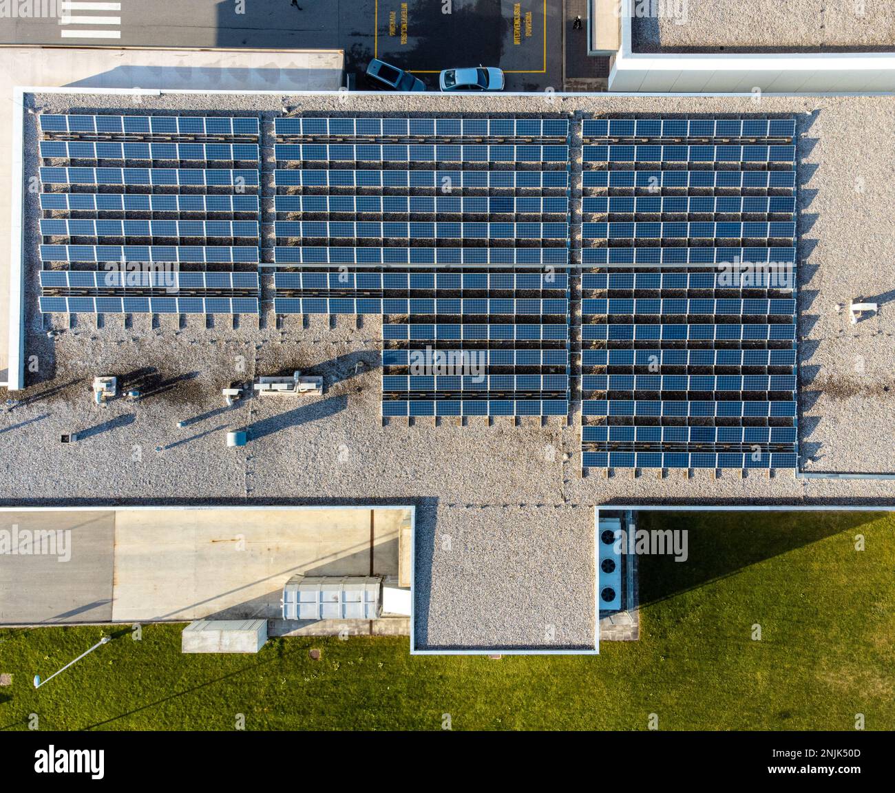 Commercial building (store) with solar panels on the roof. Drone shot ...