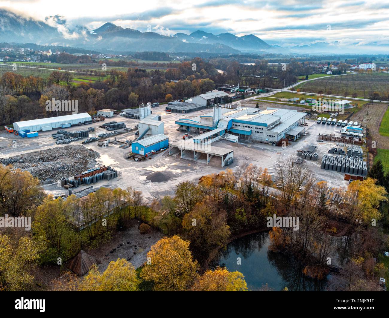 Factory that produces concrete products like tiles, concrete pipes and ...