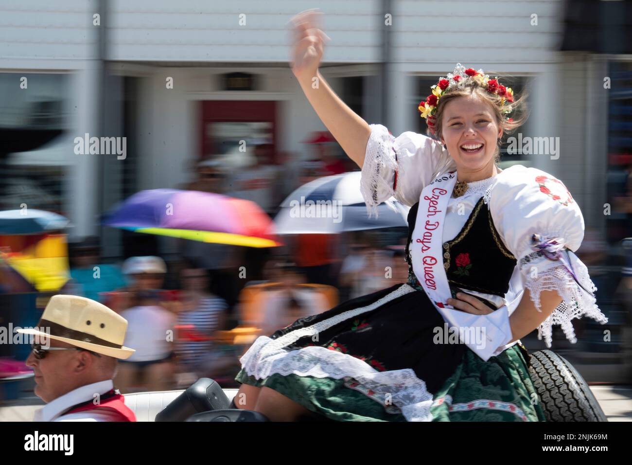 A Czech-Slovak queen runner-up waves during the Wilber Czech Festival ...