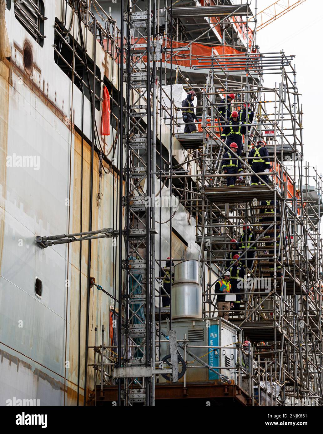 Workers leave at the end of the shift while working on one of the Joint ...