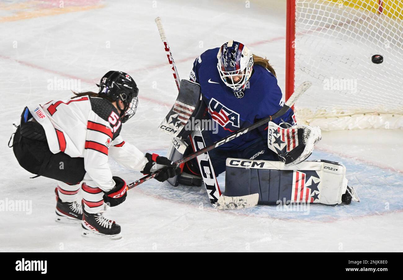 Victoria Bach (51) of Canada scores against Maddie Rooney of the USA ...