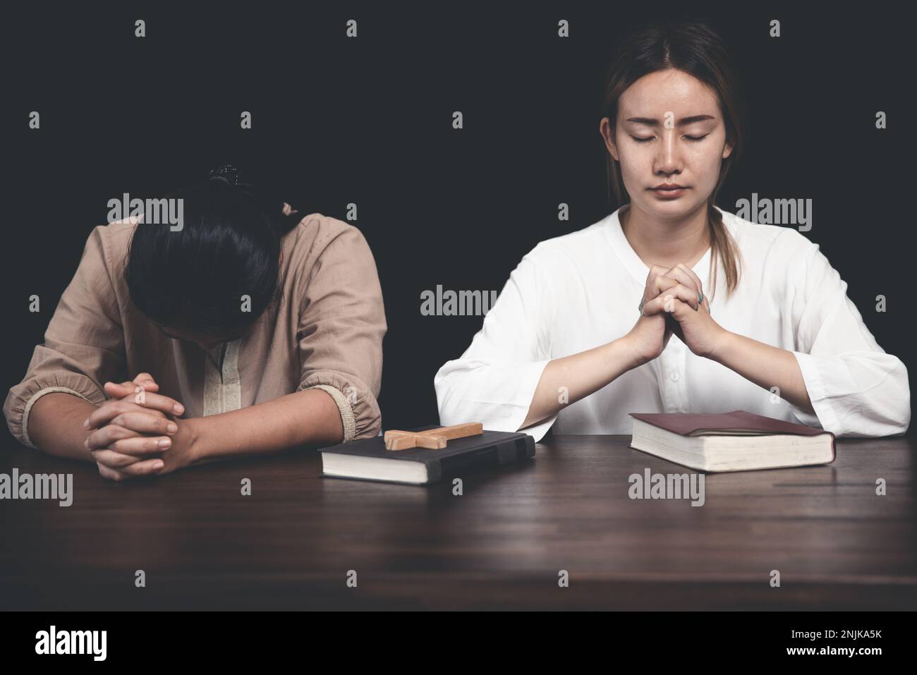 Group of people praying home christian hi-res stock photography and ...