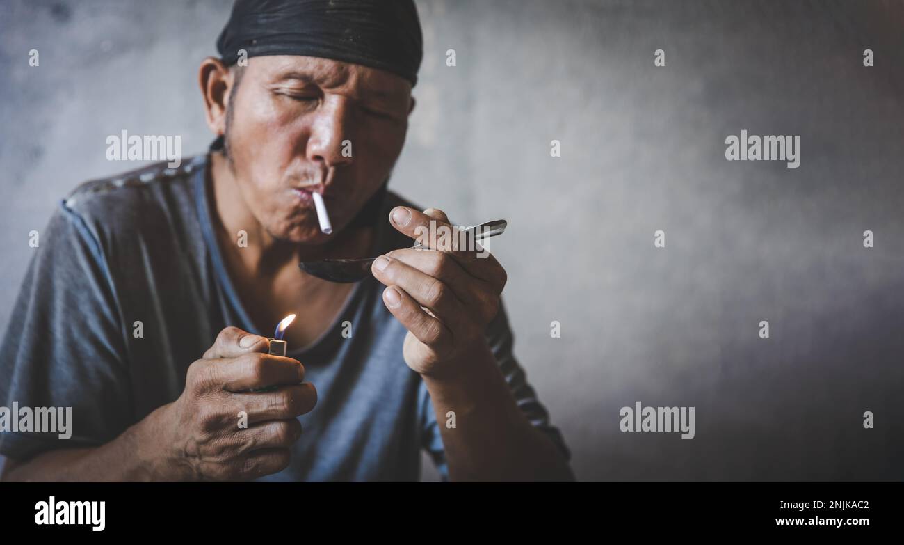 close up of people smoking cigarettes and using drugs, heroin ...