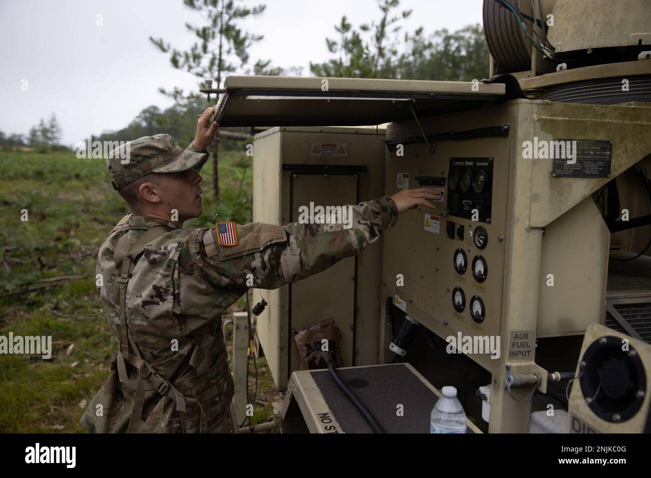 Pfc. Lawson Graham, 115 Signal Battalion, operates a generator while ...
