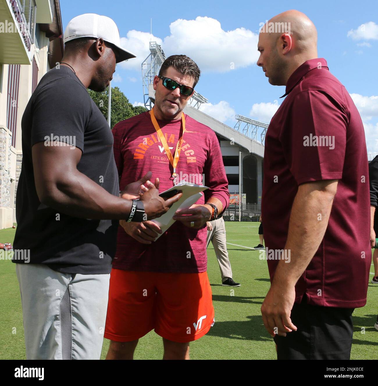 Virginia Tech coach Brent Pry, center, during Virginia Tech football ...