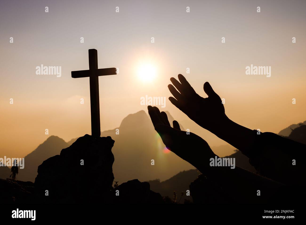 Silhouette of Human hands open palm up worship. fighting and victory ...