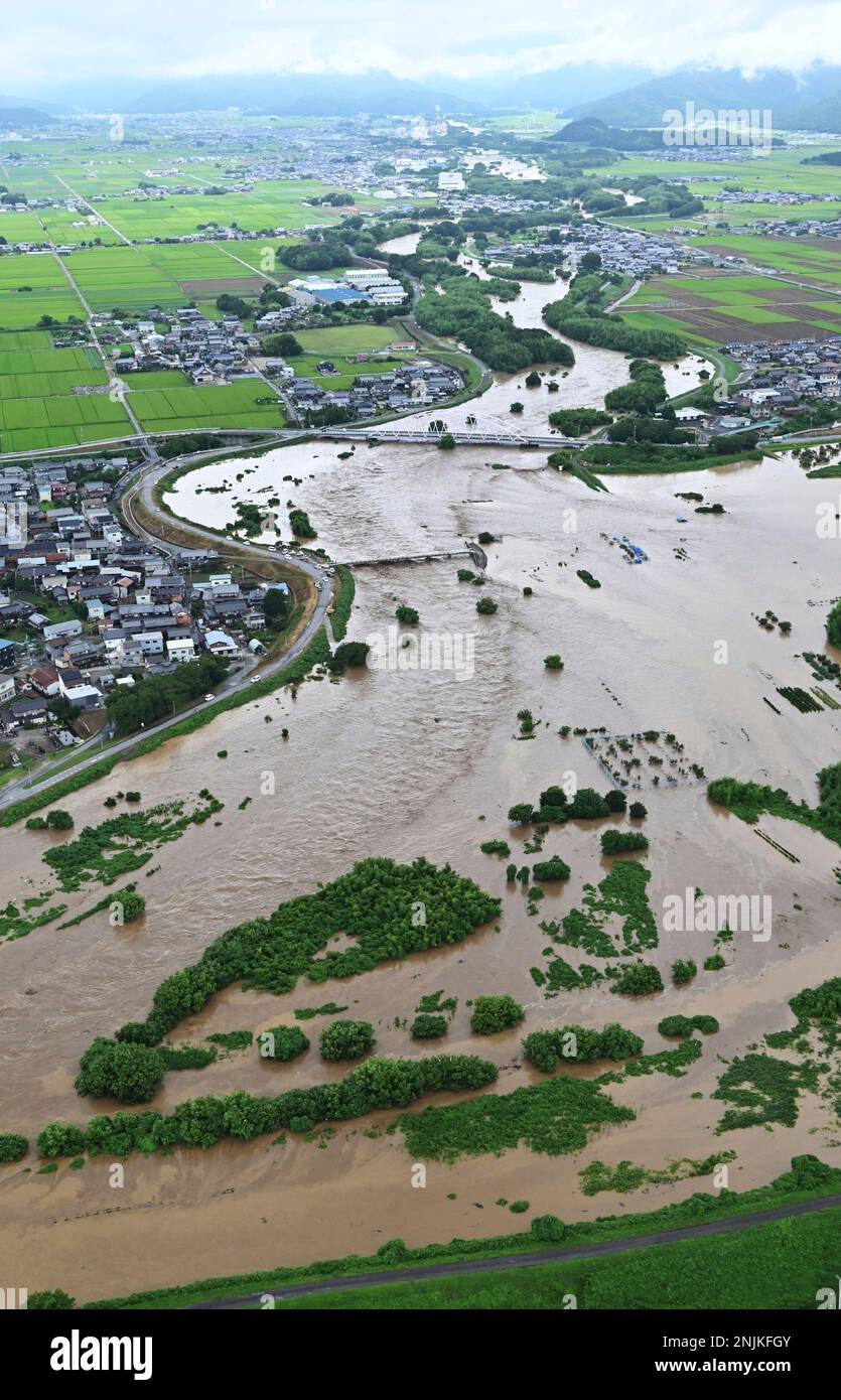 An aerial photo shows Takatoki River flooding due to torrential rain in ...