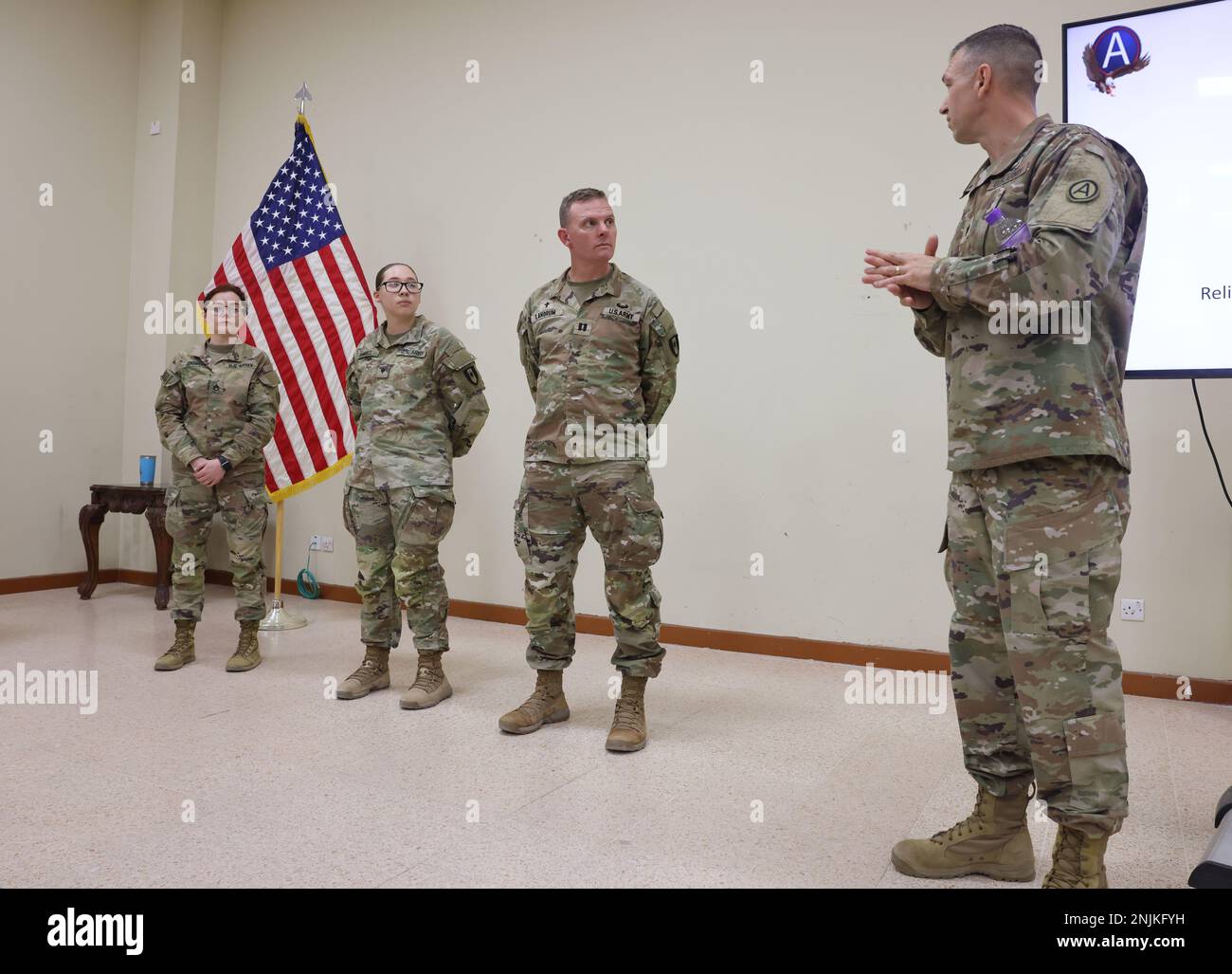 Lt. Col. Ben Hines, chaplain, Area Support Group-Kuwait, gives kudos to ...