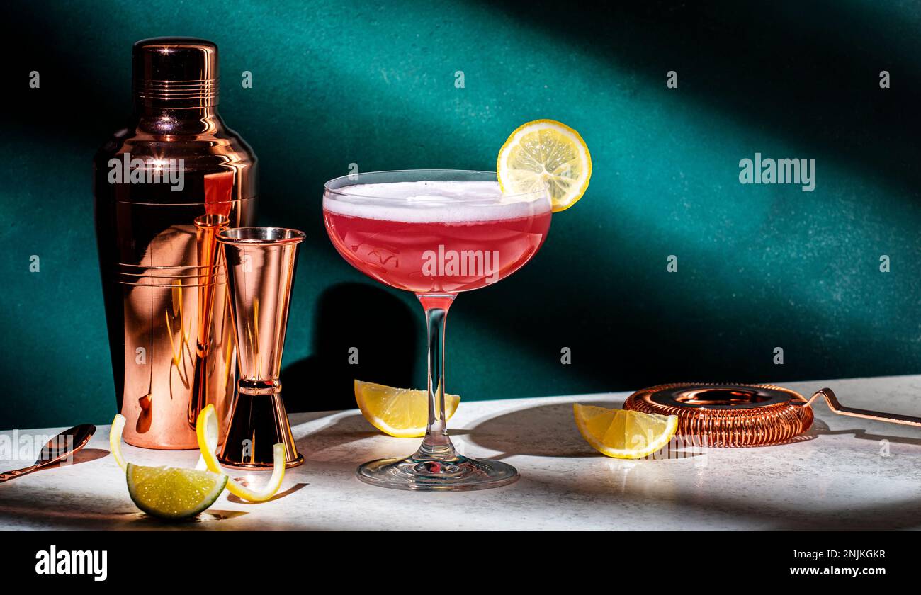 Pink lady alcoholic cocktail drink with gin, grenadine syrup, lemon ...