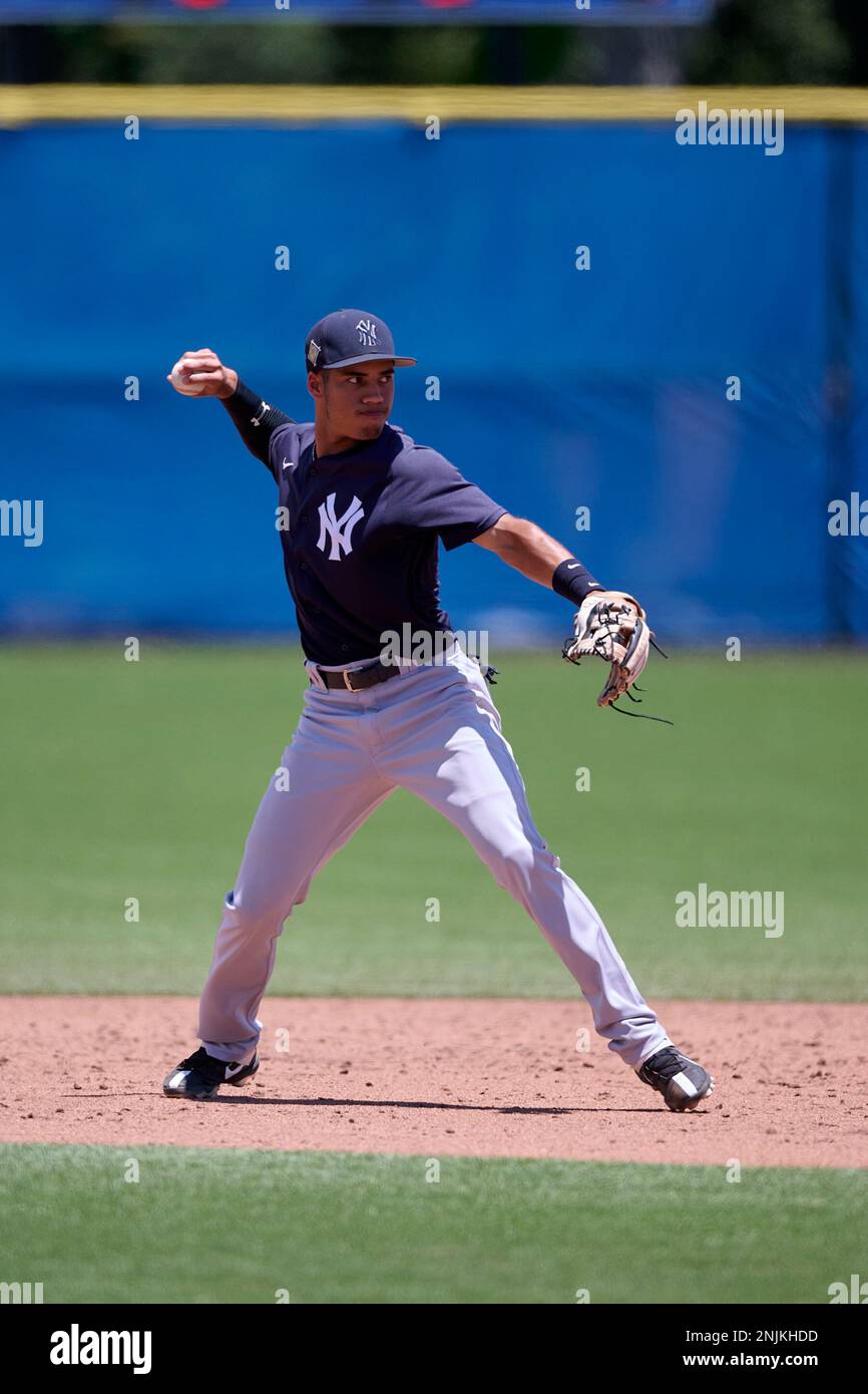 FCL Yankees second baseman Brenny Escanio (17) throws to first base ...