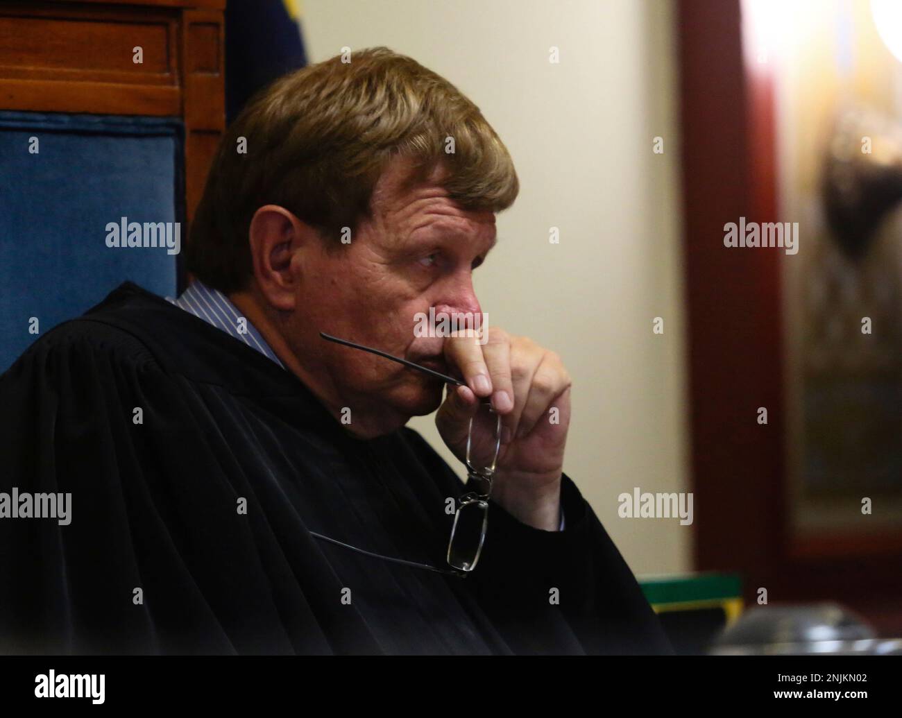 District Court Judge Kurt Krueger listens to attorneys during a ...