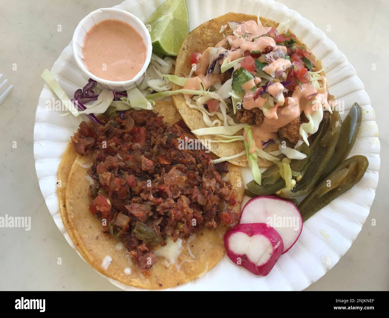 Smoked marlin taco (left) and Baja fish taco from Aguachiles el ...